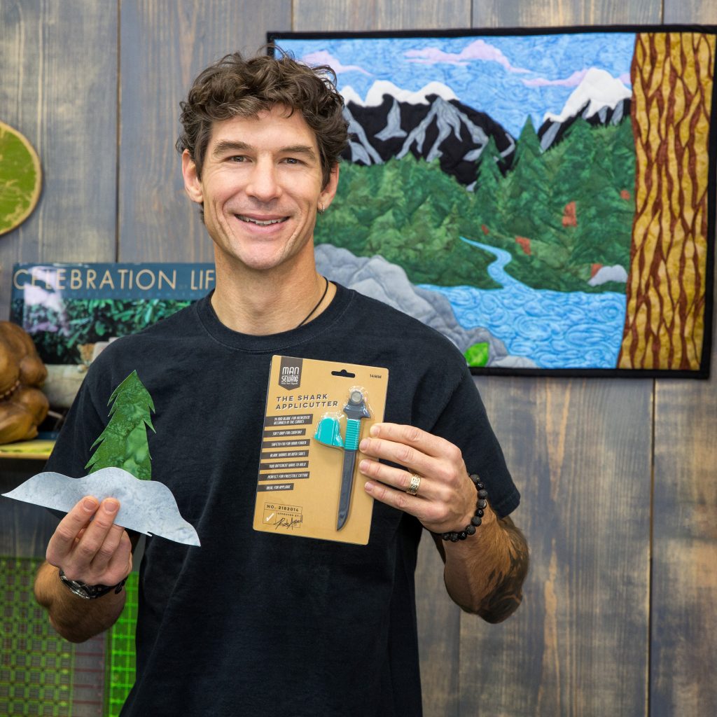 Freestyle Appliqué Landscape Quilt – Man Sewing